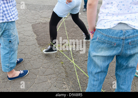 Playing with rubber rope Stock Photo - Alamy