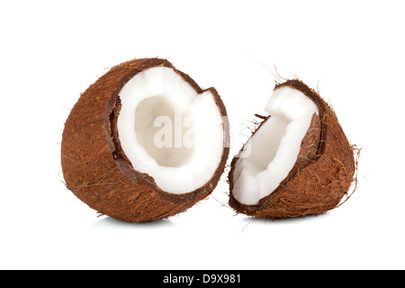 Two whole coconuts and two cracked coconut halves isolated on white ...