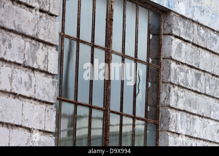 Rusty Metal Window and white birck wall Stock Photo - Alamy