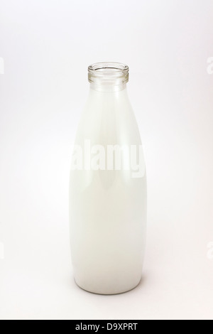 Old fashioned Bottle with milk isolated on white Stock Photo - Alamy
