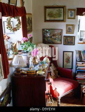 Interior of room with armchair, chest of drawers, folding screen and ...