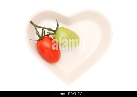 cherry tomatoes on heart-shaped plate Stock Photo - Alamy
