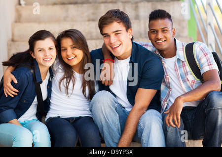Cheerful group of high school friends hanging out outside campus Stock ...