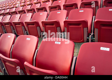 Bright red stadium seats Stock Photo - Alamy