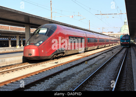 Italian burgundy red high speed train Italo in Venice, together with ...