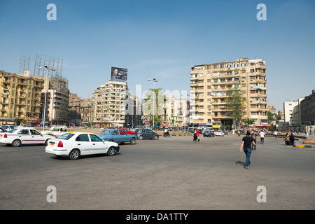 An aerial view of Tahrir Square in Cairo at night, featuring a brightly ...