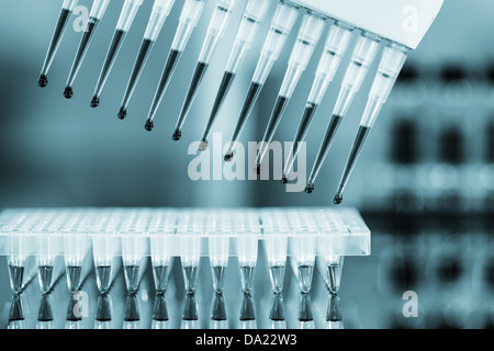 multipipette and sample tray biotech concept Stock Photo - Alamy