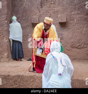 Priest holding relics from the Bete Medhane Alem Church, Lalibela Stock ...