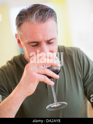 Portrait of mature man with wine glass Stock Photo - Alamy
