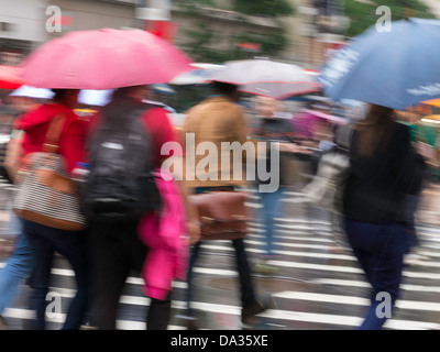 Pedestrians in Rainstorm under Brollies, NYC Stock Photo - Alamy