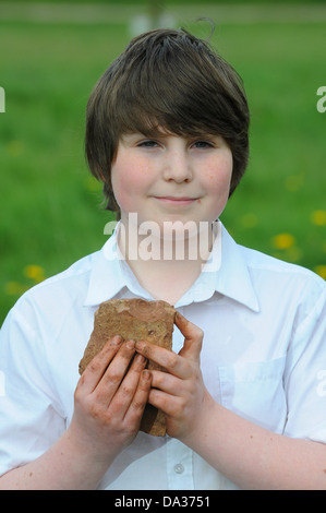 A snail fossil that has an anti-clockwise spiral on its shell, showing ...