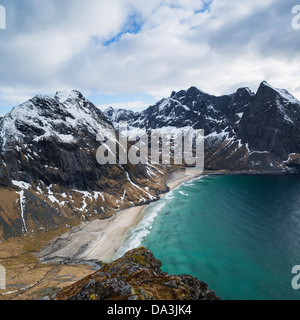 Spring snow and Kvalvika beach seen from Ryten mountain summit ...