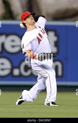 Los Angeles Angels' Collin Cowgill (19) is congratulated by Mark Trumbo ...