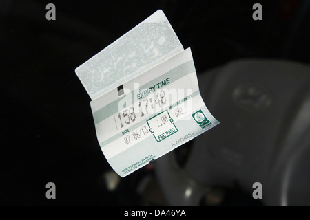Pay and display parking ticket displayed on a car dashboard with have ...