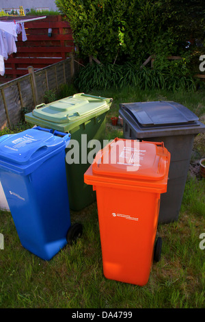 East Dunbartonshire recycling wheelie bins in garden Stock Photo - Alamy