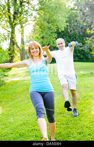 Middle aged man training with dumbbells, record on videocamera Stock ...