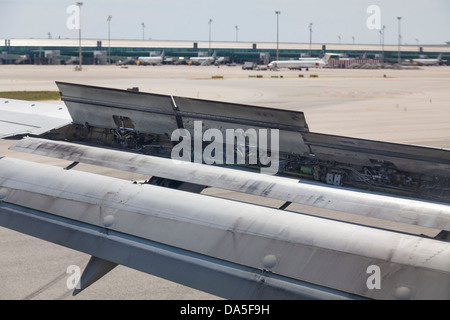 aircraft wing spoiler deployed during landing showing hydraulics Stock ...