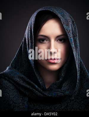 Young woman wearing arabic scarf speaking at office Stock Photo - Alamy