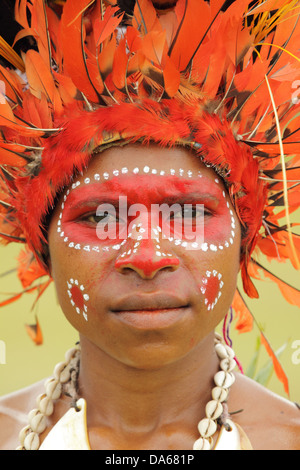 A young ethnic native woman, in traditional costume, performs a sacred ...
