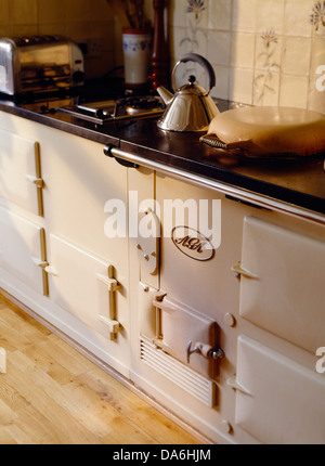 Cream Aga oven in country kitchen with large wooden cupboard Stock ...