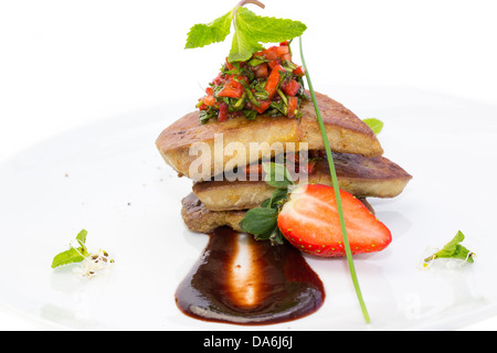 Roast goose liver is decorated with greens and strawberries Stock Photo ...