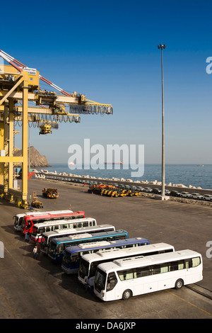 Oman, Muscat, Container port, cruise ship excursion coaches on quayside ...