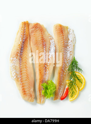 Raw haddock fish fillets, whitefish meat in kitchen tray with thyme ...