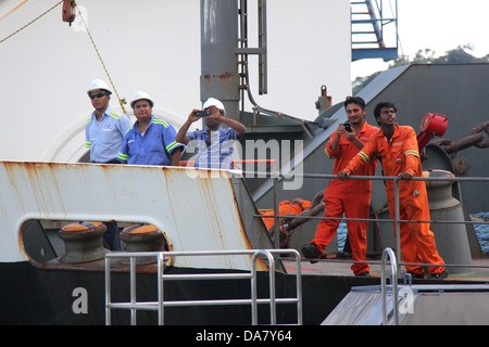 Merchant ship sailors and Panama Canal workers smiling as they transit ...