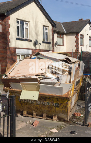 Building work waste in a skip awaiting removal, with NO ASBESTOS sign ...