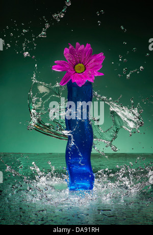 Splashing water with drops in bright colors and shapes Photographed in ...