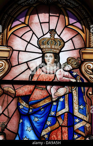 Virgin Mary with baby Jesus in dress made of gold thread, in the ...
