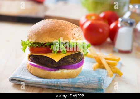 hamburger fast food with plenty of raw materials on the background ...
