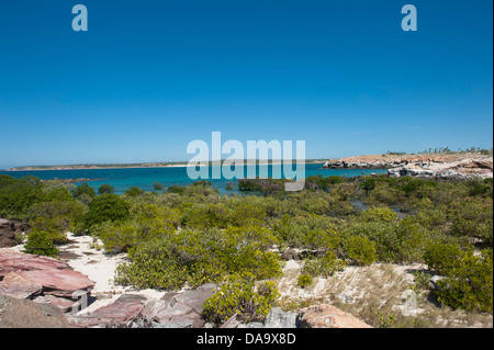 Rocky Bay with sandy beach and mangrove mudflats at One Arm Point, Cape ...