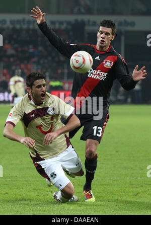 Leverkusen's Michael Ballack vies for the ball with Augsburg's Jan ...