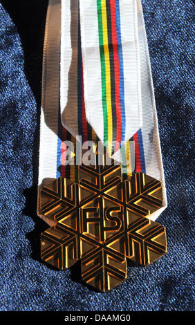 The medals of the International Ski Association FIS in silver (l-r ...