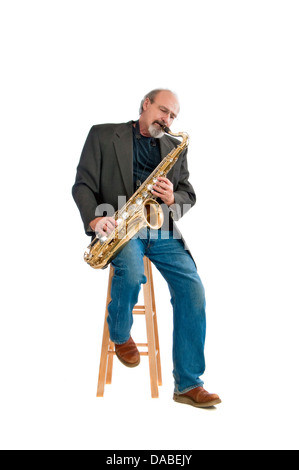Adult musician playing tenor saxophone, blue smoky background Stock ...