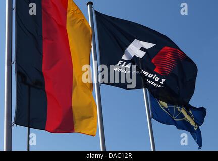 The flags of the Nürburgring, the German flag and the flags of the FIA ...