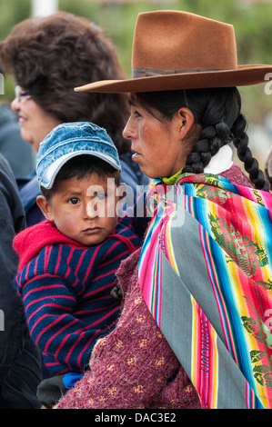 Inca incan mother woman in traditional blanket and carrying child baby ...