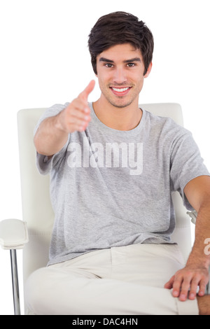Young man ready to shake hand Stock Photo - Alamy