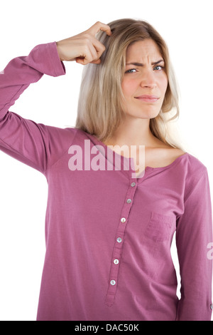 Beautiful young blonde woman scratching the head Stock Photo - Alamy