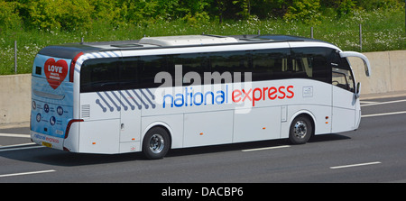 National Express coach side and back view driving on M25 motorway Essex ...