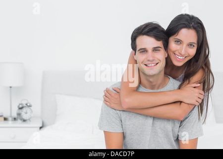 Portrait of a woman embracing her partner Stock Photo - Alamy