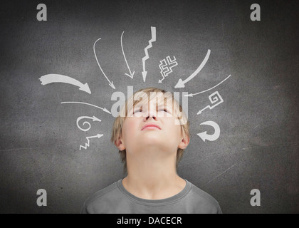 Hesitating child looking up Stock Photo - Alamy