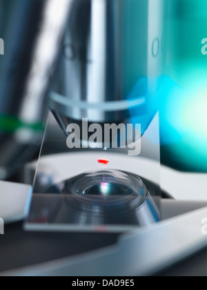 Blood testing, A light microscope examining a sample of blood in a lab ...