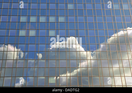 Reflection of a cloudy sky in glass wall of an office building Stock ...