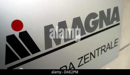 A sign with the logo of the Magna Europe Headquarters (German 'Magna ...