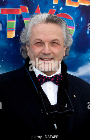 (R to L) Australian film director George Miller shakes hands with the ...