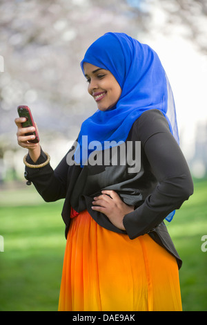 Mobile phone in female hands close-up Stock Photo - Alamy