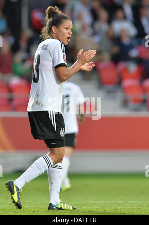 Celia Okoyino da Mbabi (r) of Germany fights for the ball with Marita ...