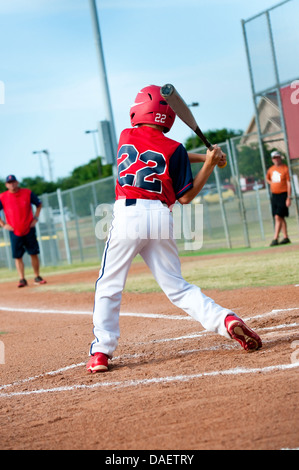 Youth baseball game action Stock Photo - Alamy